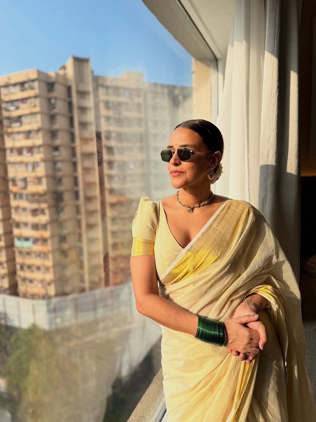 Neha Dhupia keeps it minimal with South Indian 'Kasavu' saree at a wedding