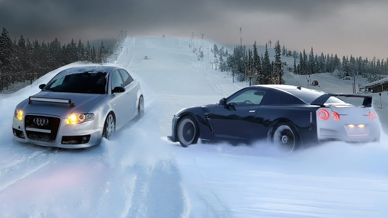 Cars drifting up a snowy ski slope