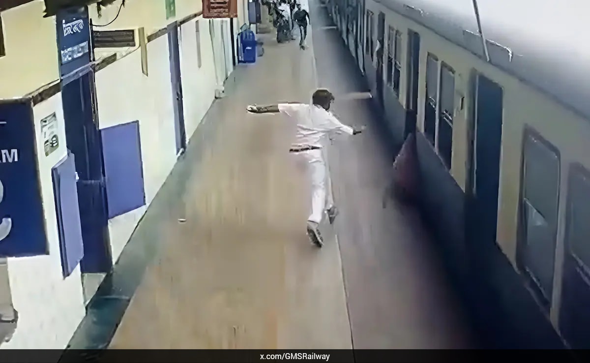 Railway staff's quick action saves woman from falling under moving ...