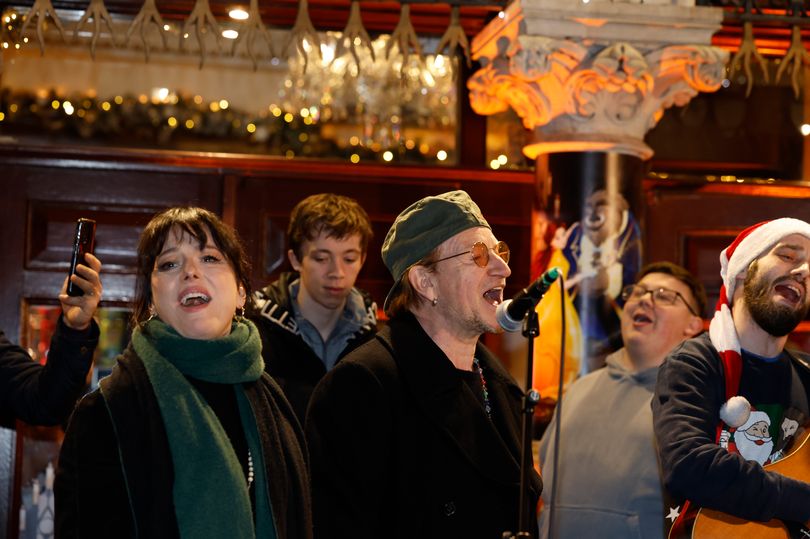 Bono and Imelda Mary join annual Dublin city Christmas Eve busking session