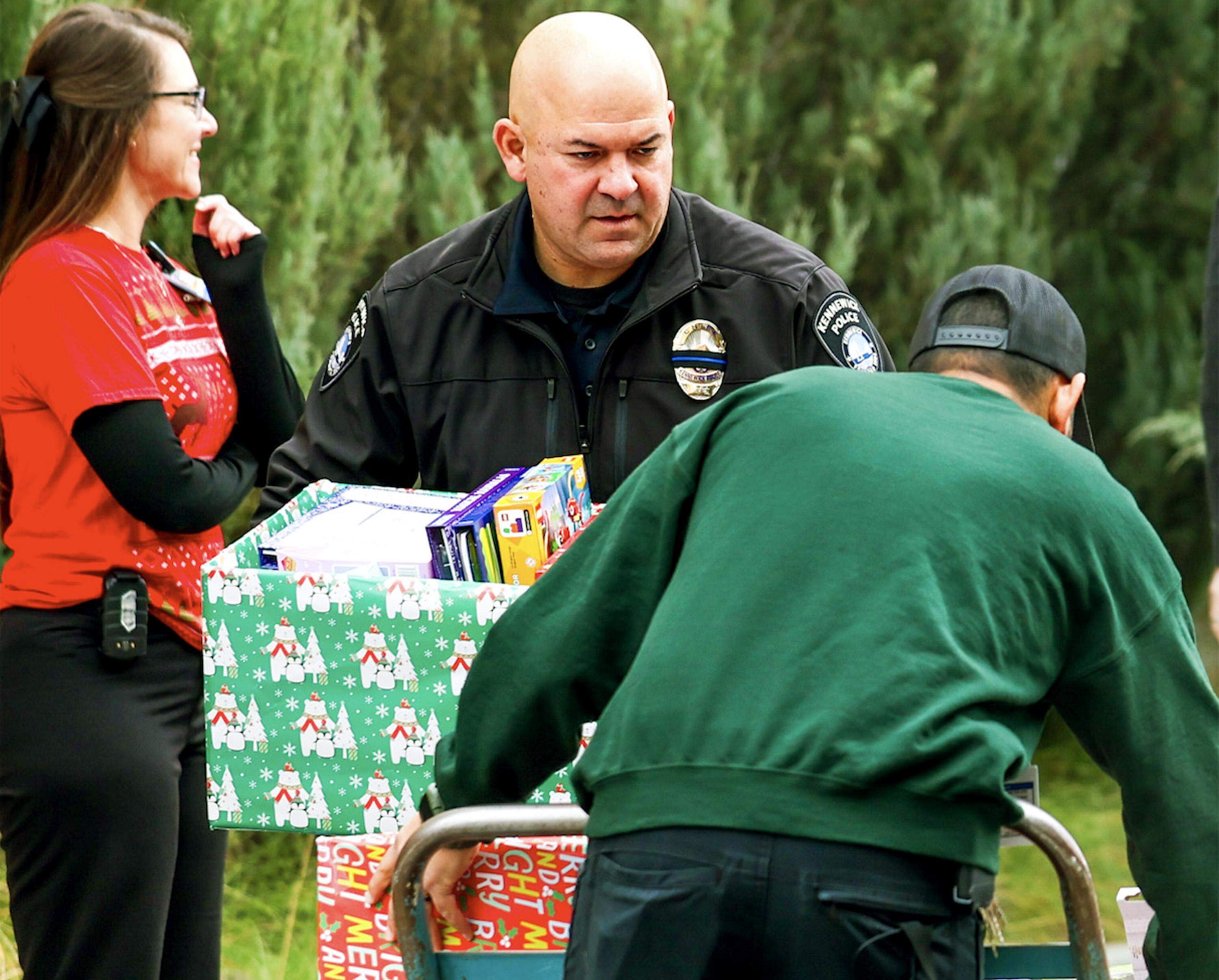 Local radio station, Kennewick police deliver joy to kids in the hospital