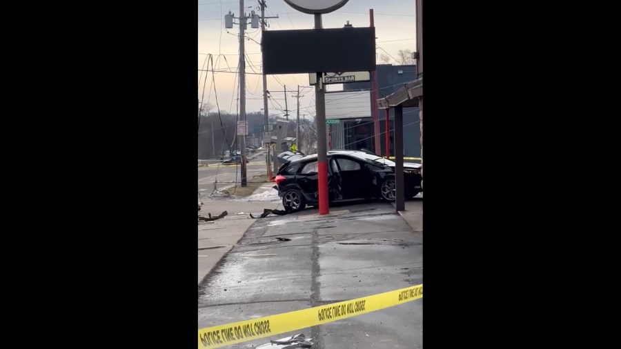 Police: Car hit pole, building on Division Ave.