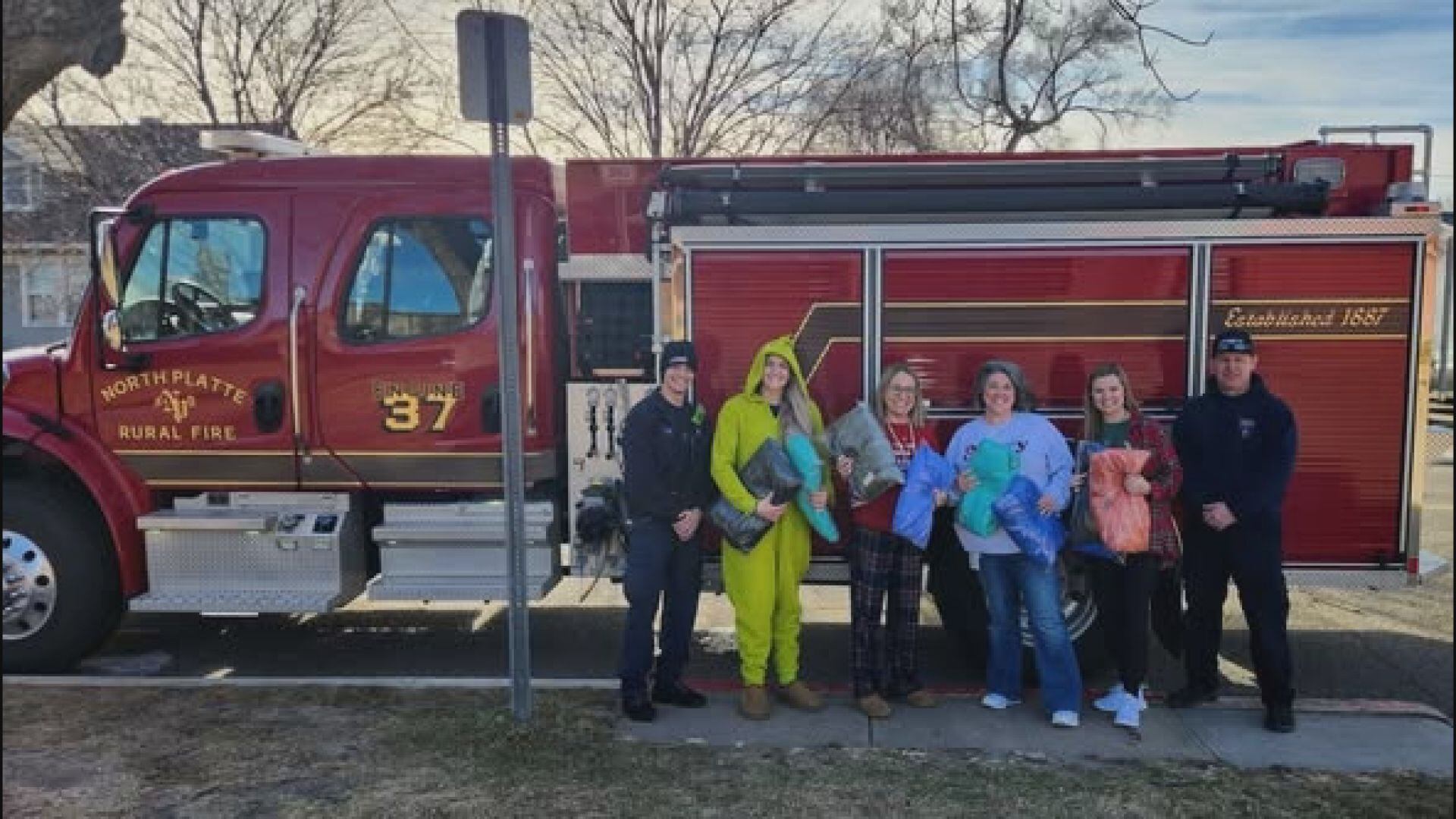Firefighters deliver 60 winter coats to North Platte students