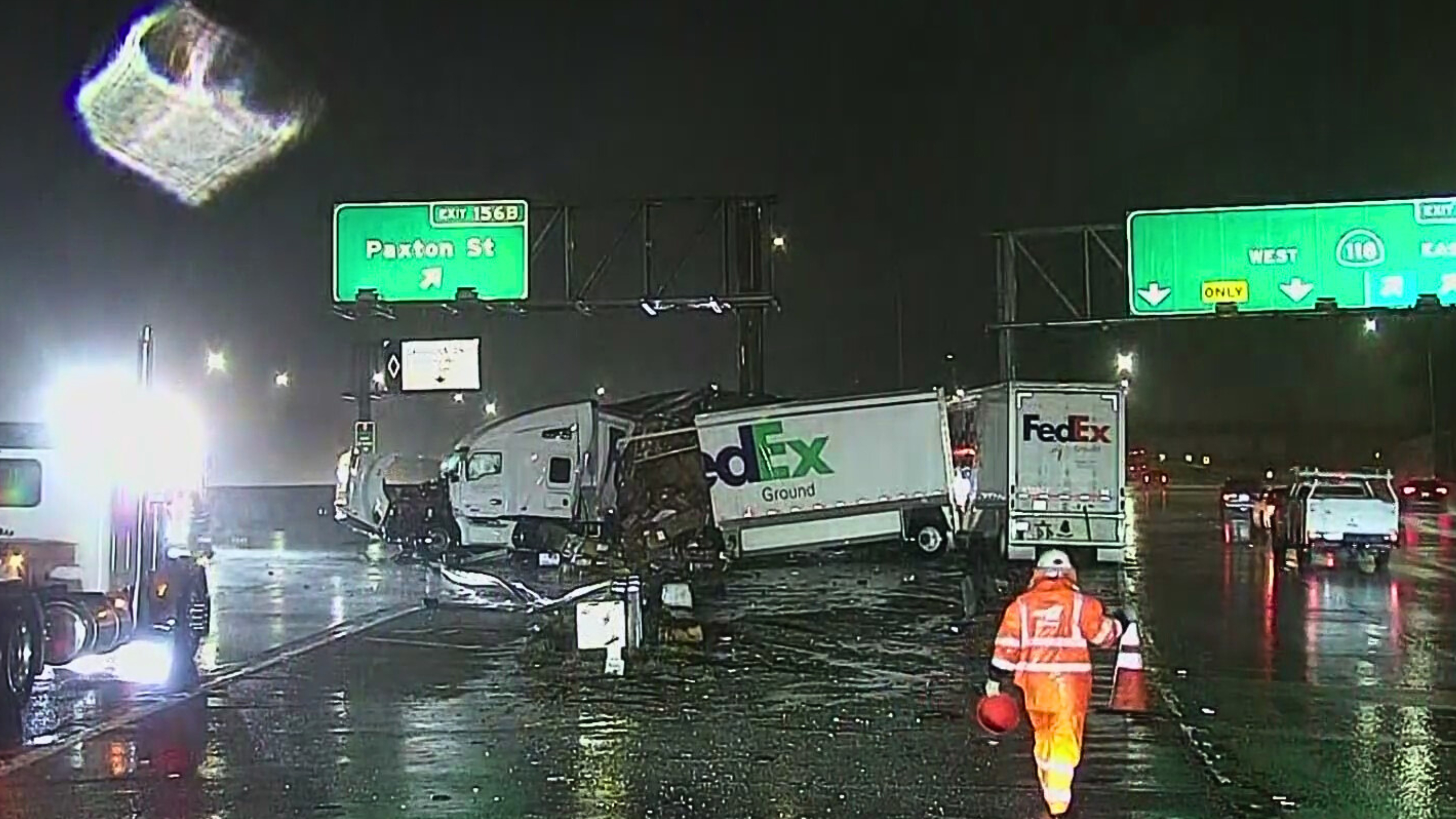 LA freeway crash sends FedEx packages flying as storm hits just before ...