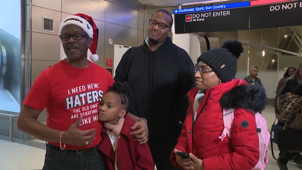 Families reunite at Atlanta airport as holiday travel turns arrivals ...