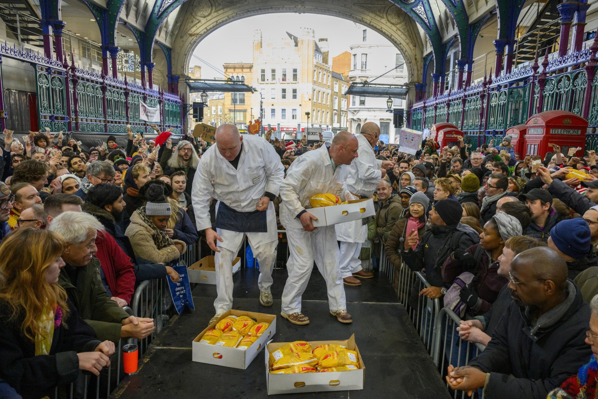 Auction crowds battle for meat at iconic London market