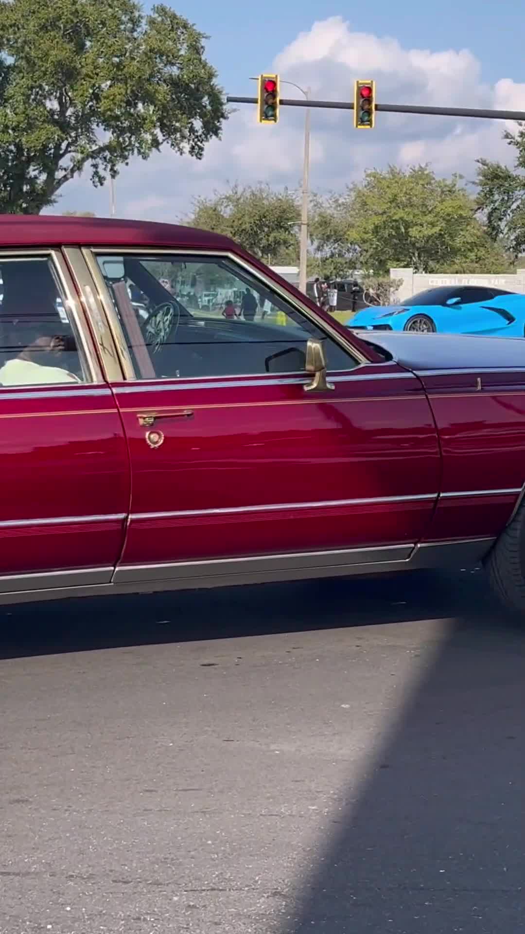 Candy red Cadillac on gold 26’s riding