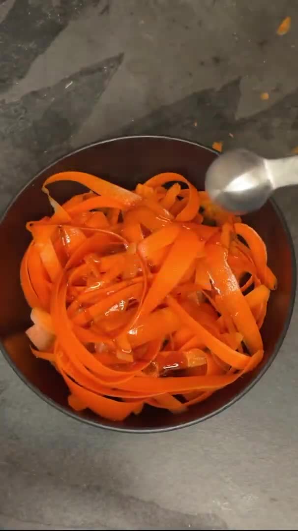 Shave carrots into a bowl 🥕