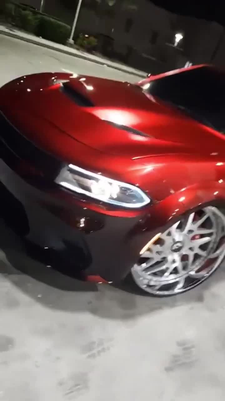 Candy red widebody Hellcat Dodge Charger on 24’s Forgiatos