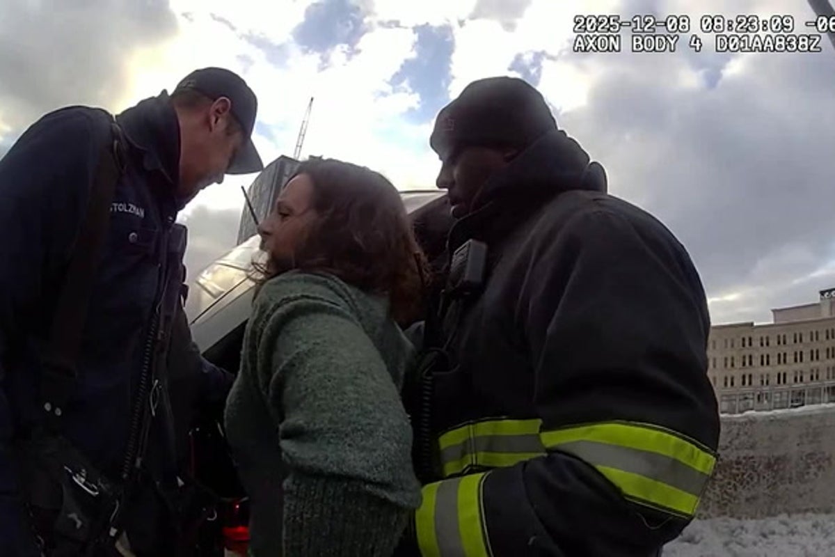 Dramatic moment shows cops rescuing FBI agent from dangling car