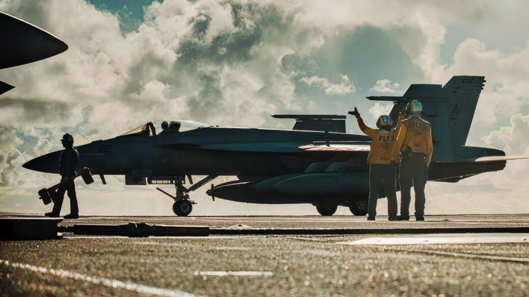 Landing on a US Navy nuclear aircraft carrier is a controlled crash at ...
