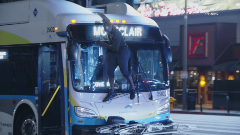 Man shouting from bus roof sparks tense standoff in downtown LA