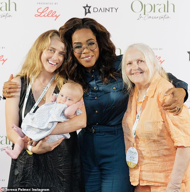 Oprah Winfrey is all smiles as she cradles Aussie actor's newborn baby ...