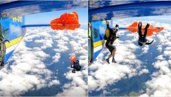 Viral video: Skydiver left dangling 15,000 ft after parachute snags ...