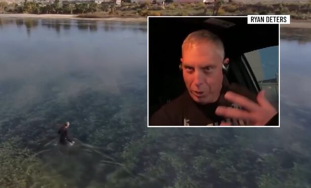 The Colorado River’s water level is so low that a man can walk across it