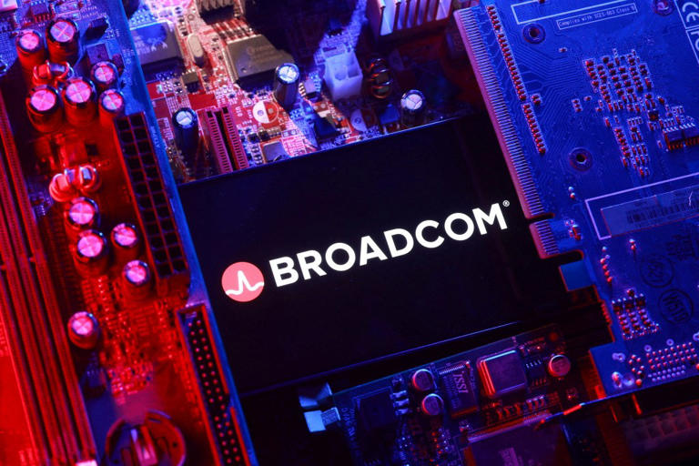 Dow tumbles after hitting record high, while Broadcom latest to fuel AI ...