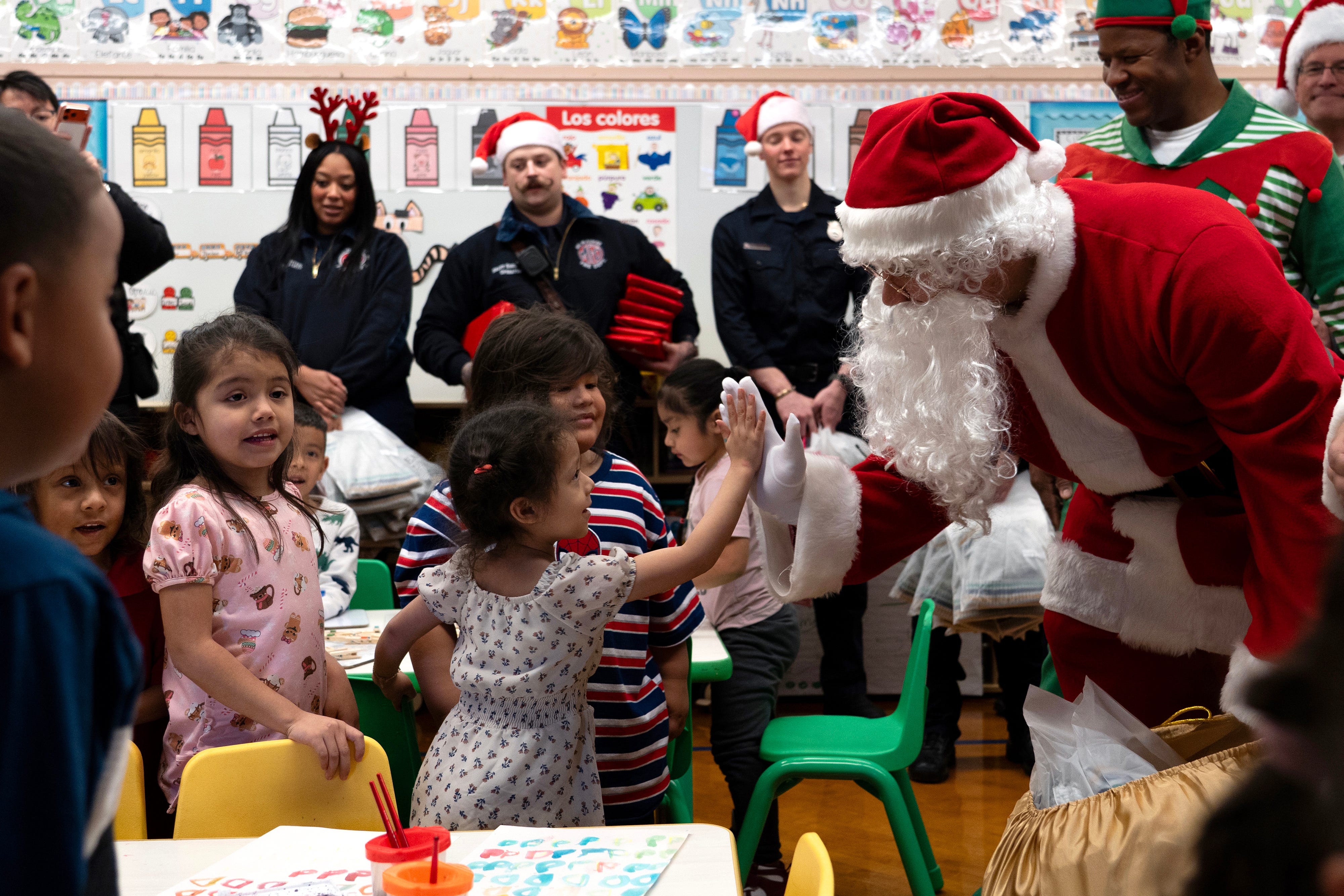 Community groups surprise Kagel Elementary students with holiday gifts