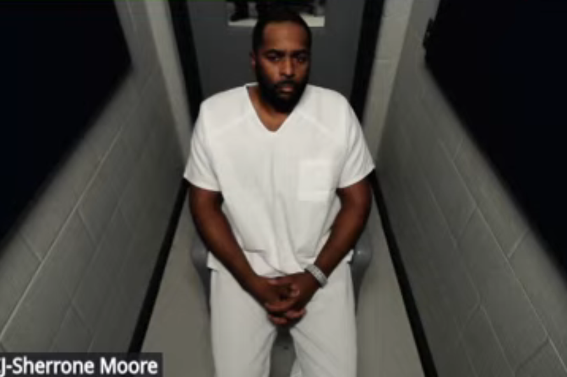 Sherrone Moore pictured in jail wearing jumpsuit as he can't attend court