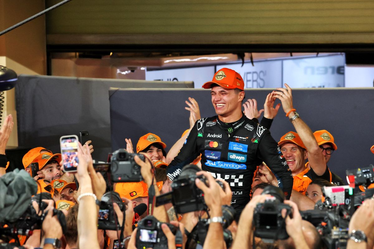 Norris lifts the World Drivers' Championship trophy for the first time
