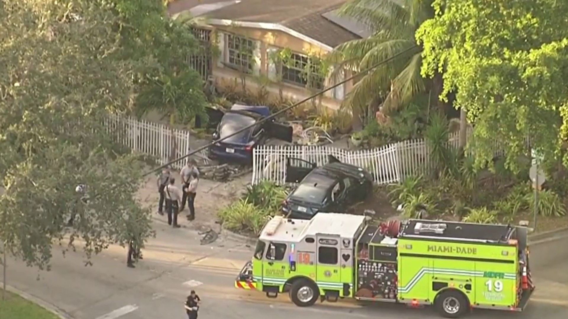 4 hospitalized after cars crash into front yard of NW Miami-Dade home