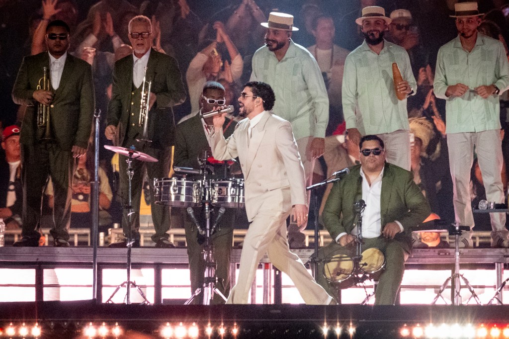 Bad Bunny slips & falls during concert, but his fans keep the show ...