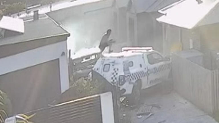 Cop car pulls into driveway before almighty smash