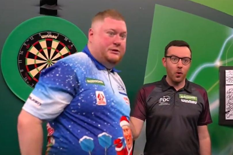 Darts star suffers embarrassing wardrobe malfunction before passionate ...