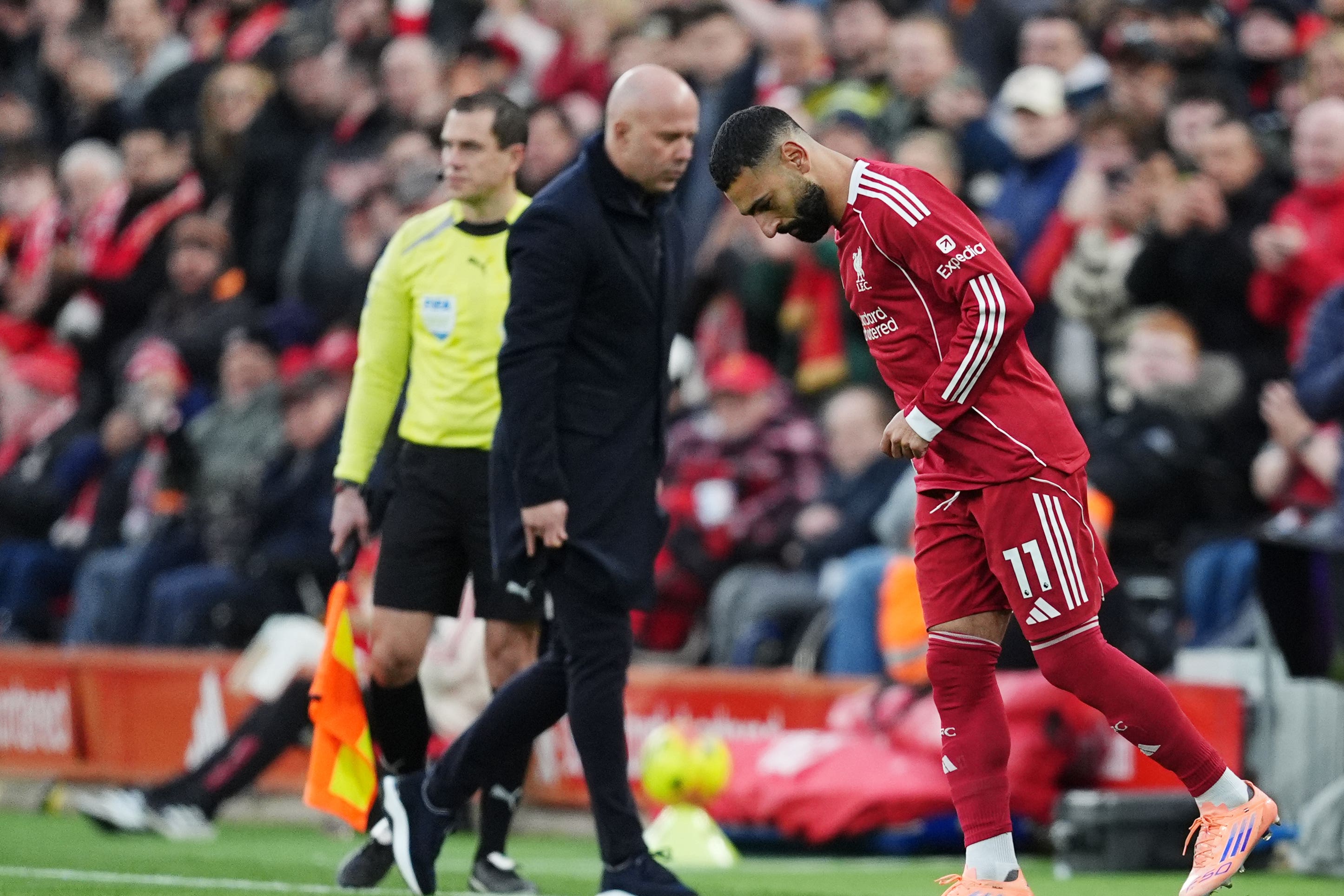 Salah pats badge and applauds fans after possible Liverpool farewell