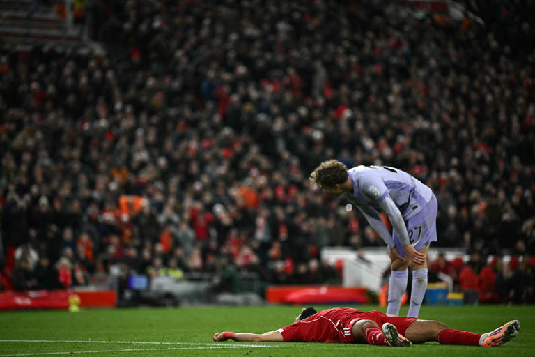 Salah pats badge and applauds fans after possible Liverpool farewell