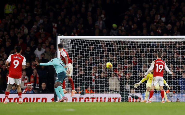 Soccer-Arsenal get lucky break to go five points clear, Salah returns ...