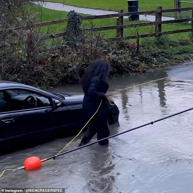 Panic in a puddle: Moment fire crew 'rescue' woman after she gets stuck ...