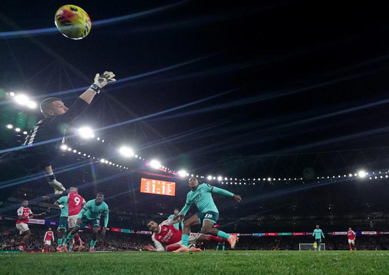 Soccer-Arsenal get lucky break to go five points clear, Salah returns ...