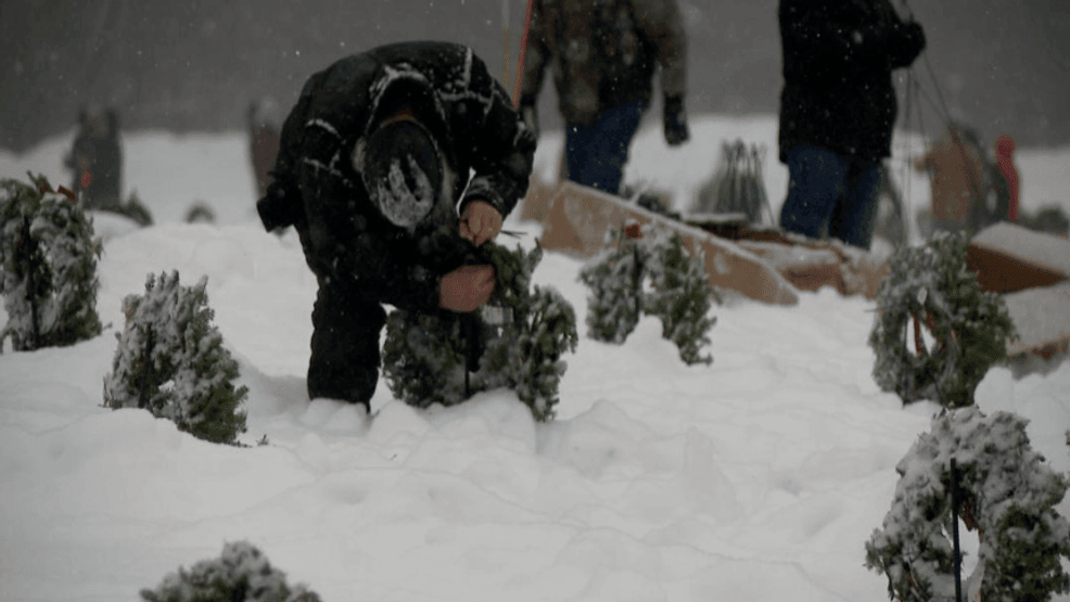 Hundreds honor veterans despite snow on Wreaths Across America Day
