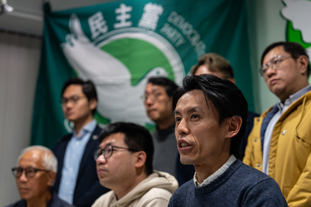 Hong Kong's biggest pro-democracy party votes to disband after more ...