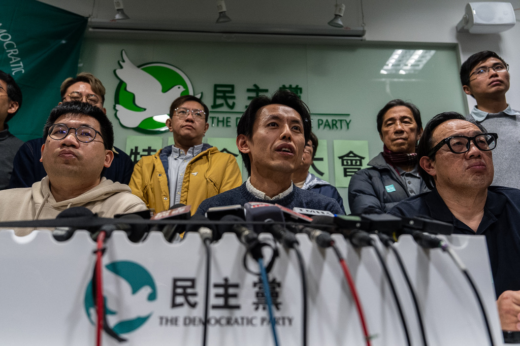 Hong Kong's biggest pro-democracy party votes to disband after more ...