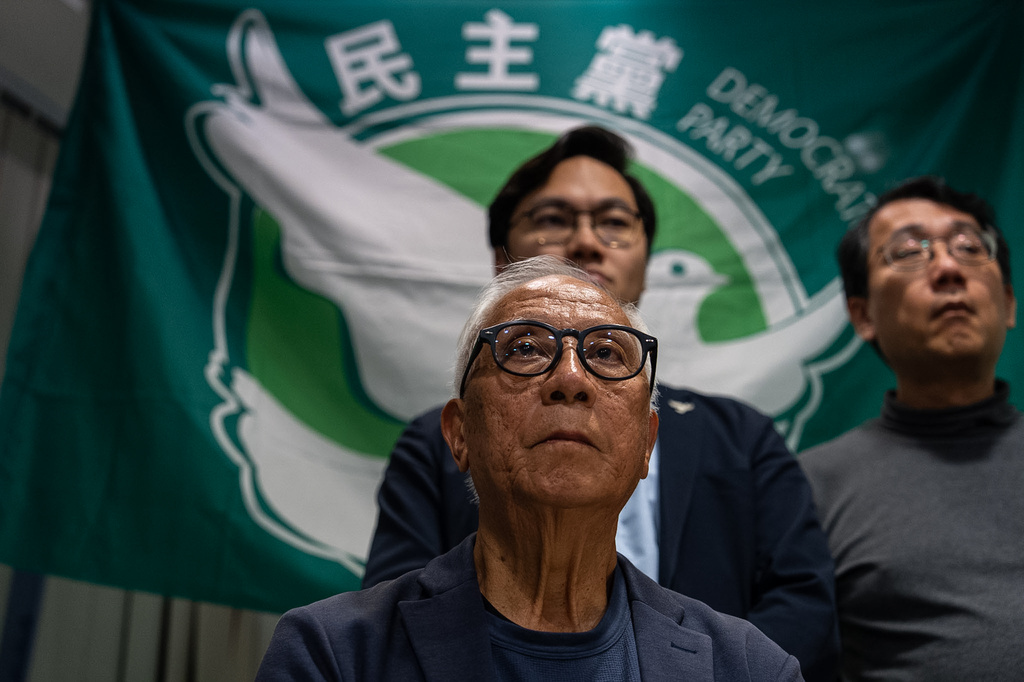 Hong Kong's biggest pro-democracy party votes to disband after more ...