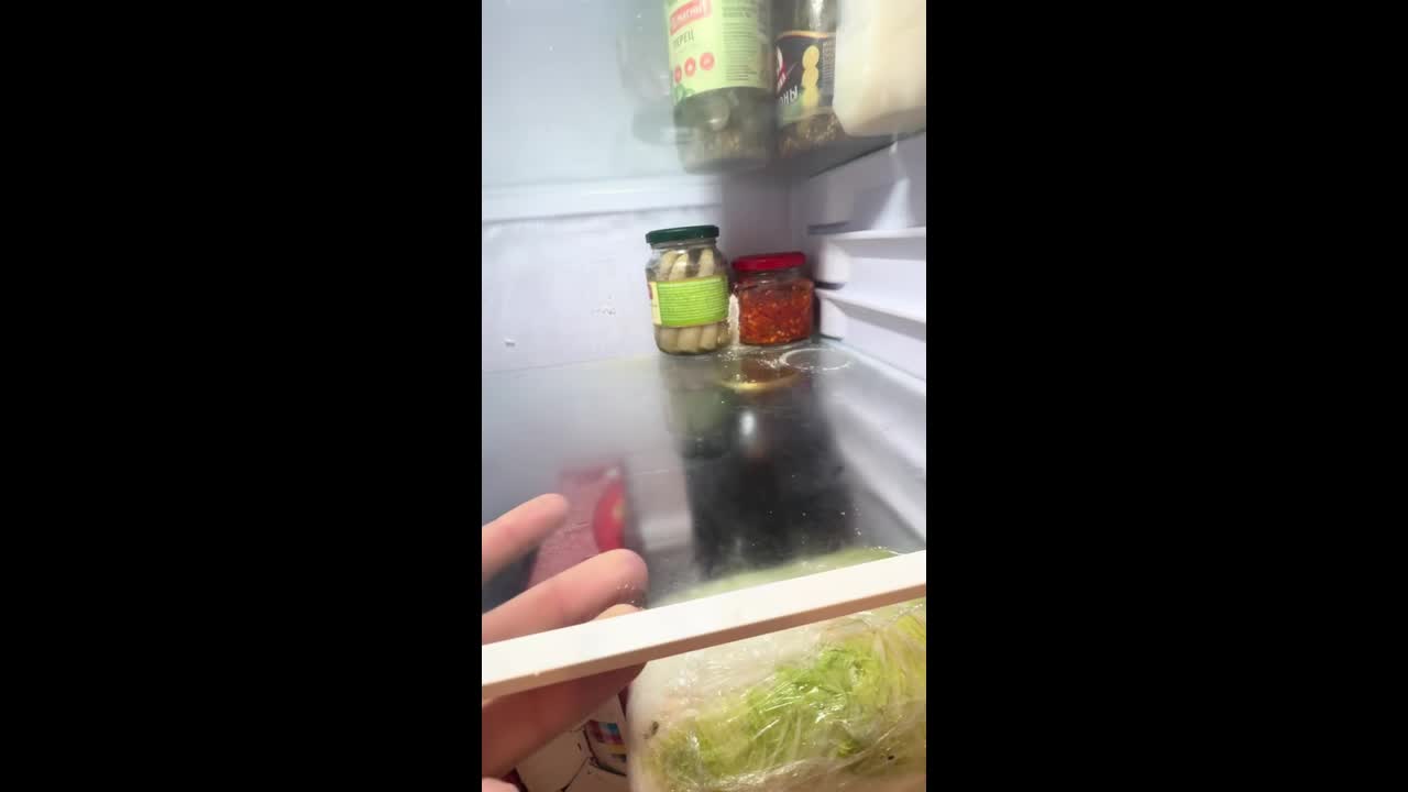 Glass jars hilariously stuck in fridge shelf in Novosibirsk, Russia