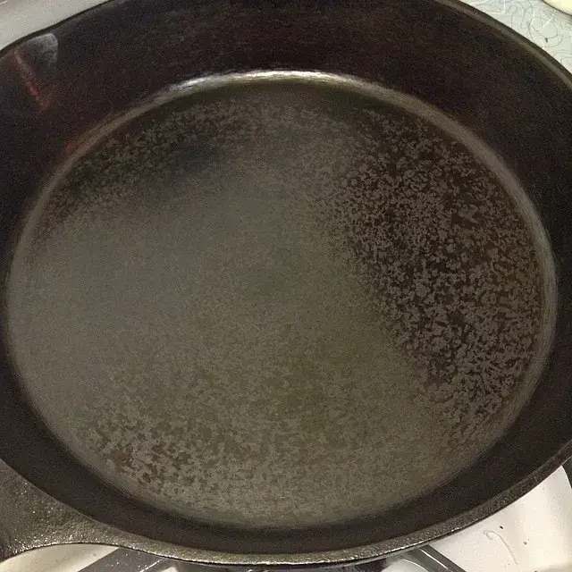 If you're still seasoning your cast iron like this, you're doing it ...