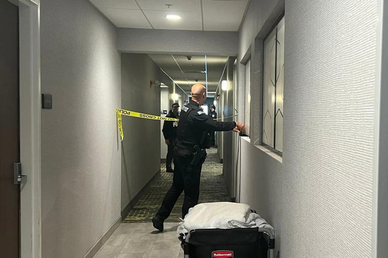 Inside Brown shooting person of interest's hotel room as hand gun with ...