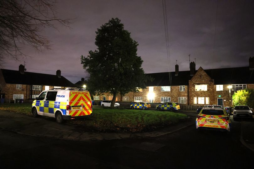 Police block off road after 'man seen with knife'