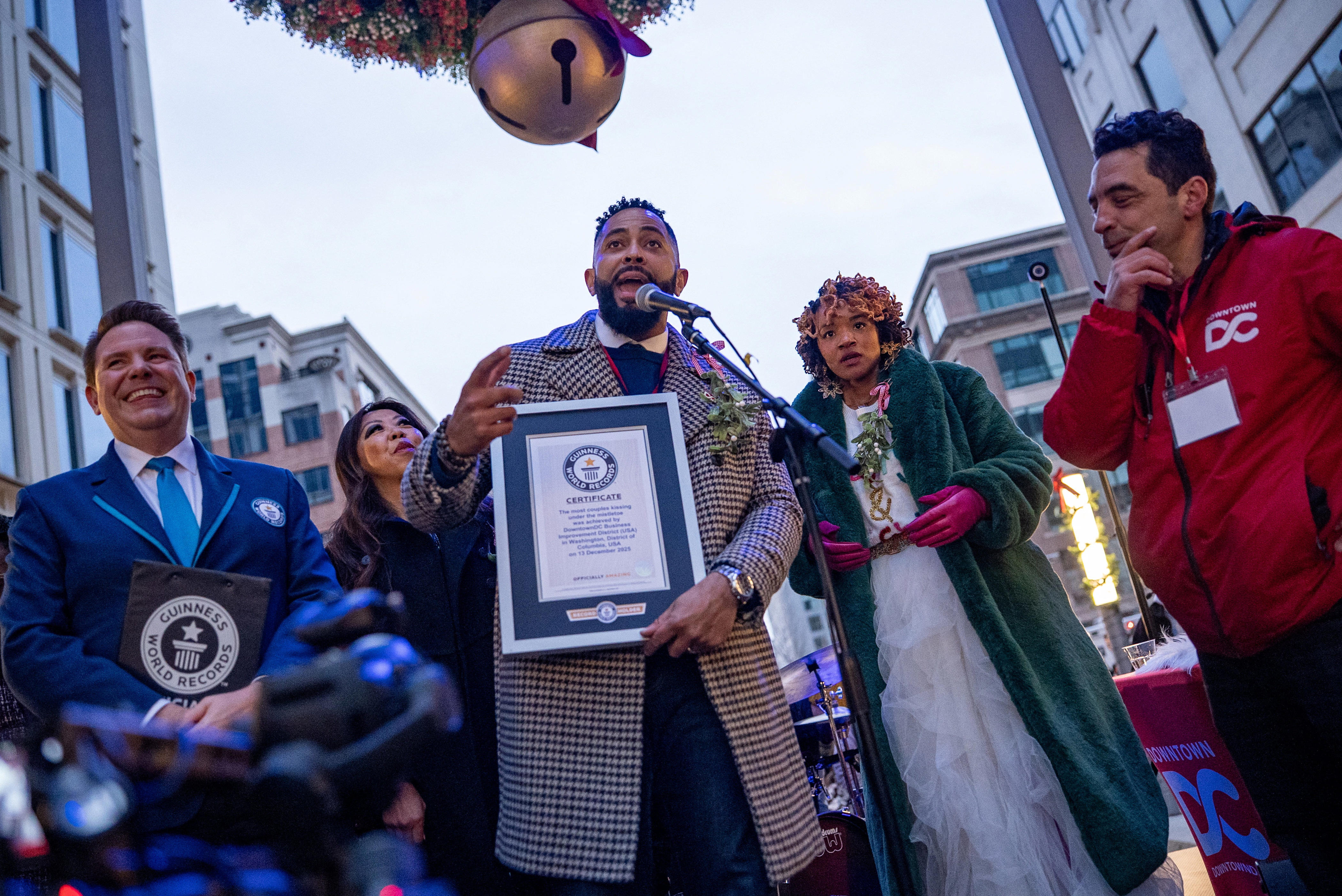 What happens when 1,435 couples kiss under mistletoe? They break records