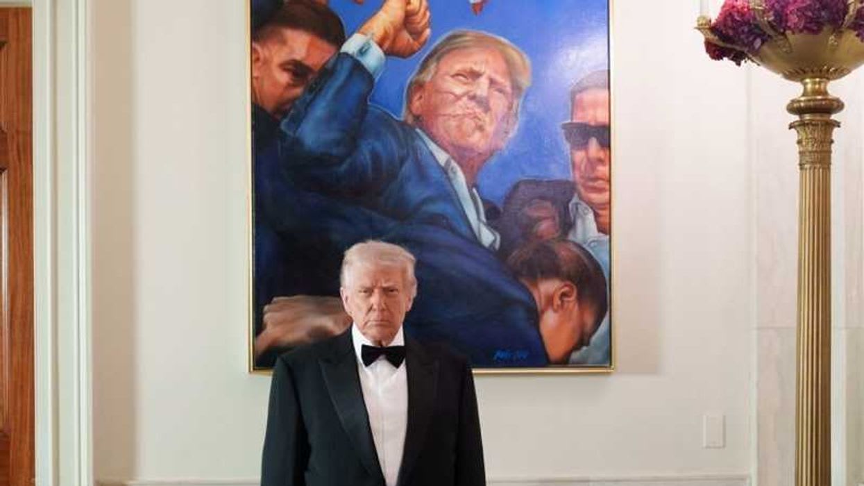 Trump poses with a photo from his assassination attempt after a wave of ...