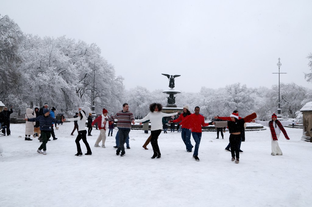 NYC blanketed in snow as kids, dogs and dancers delight