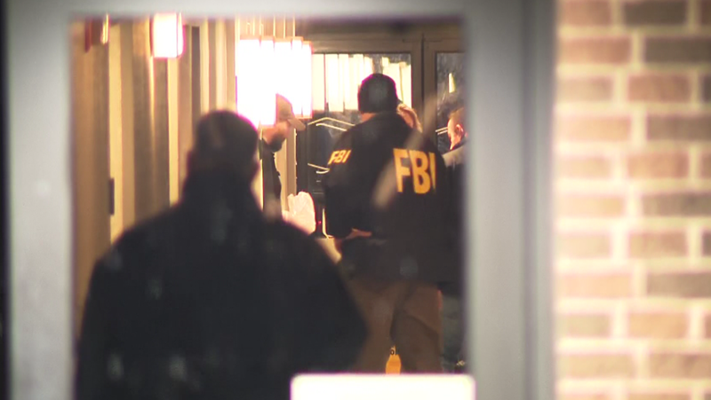 Person of interest in custody in deadly Brown University shooting