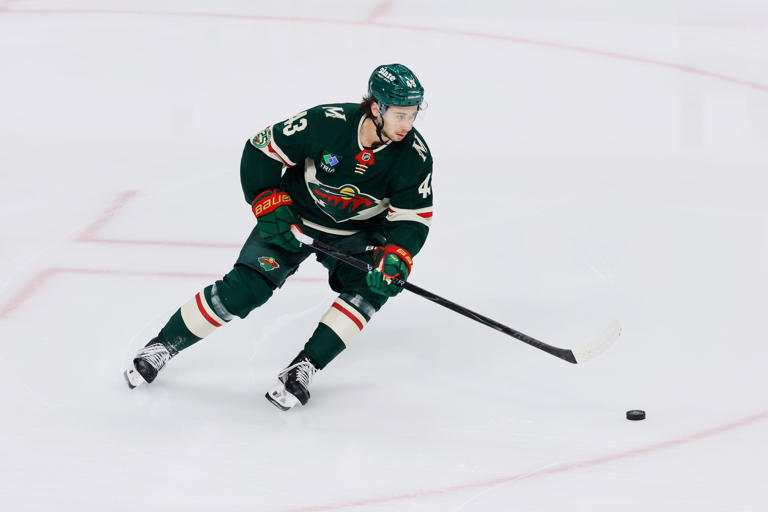 Quinn Hughes scores in Minnesota debut as Wild beat Bruins 6-2 for 4th ...