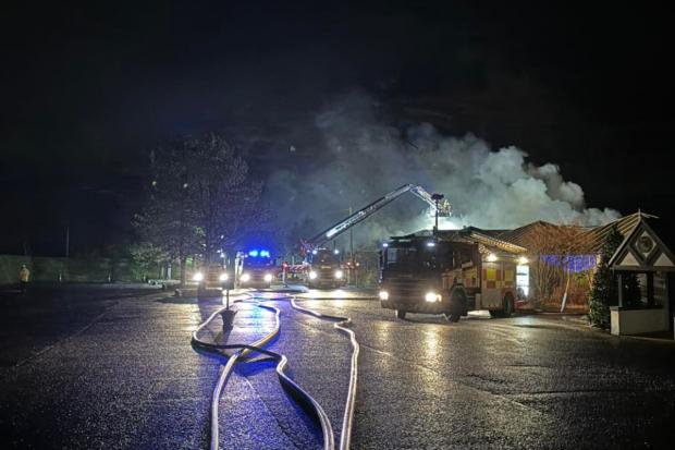 Beloved garden centre 'burned down' as crews continue to battle huge blaze
