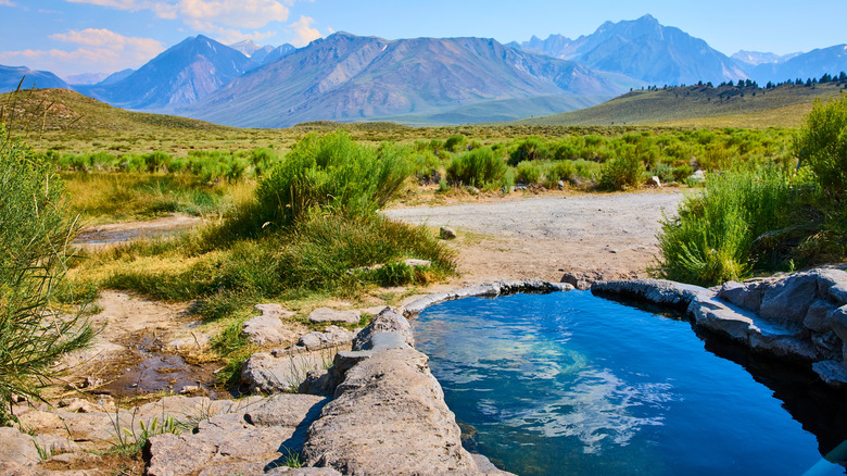 California's natural hot spring near Yosemite brims with snow-capped ...