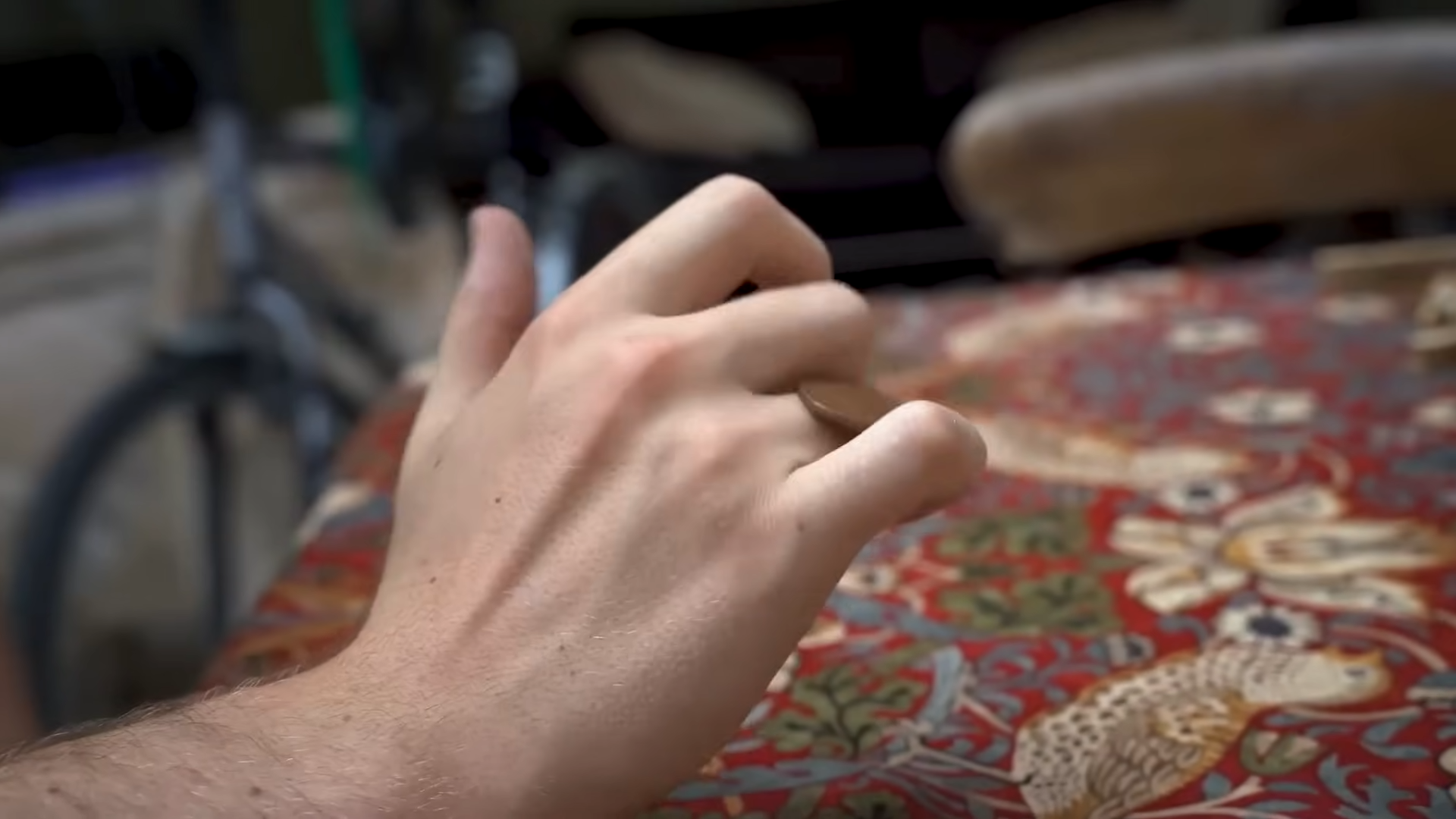 How to roll a coin across your knuckles in 3 easy steps
