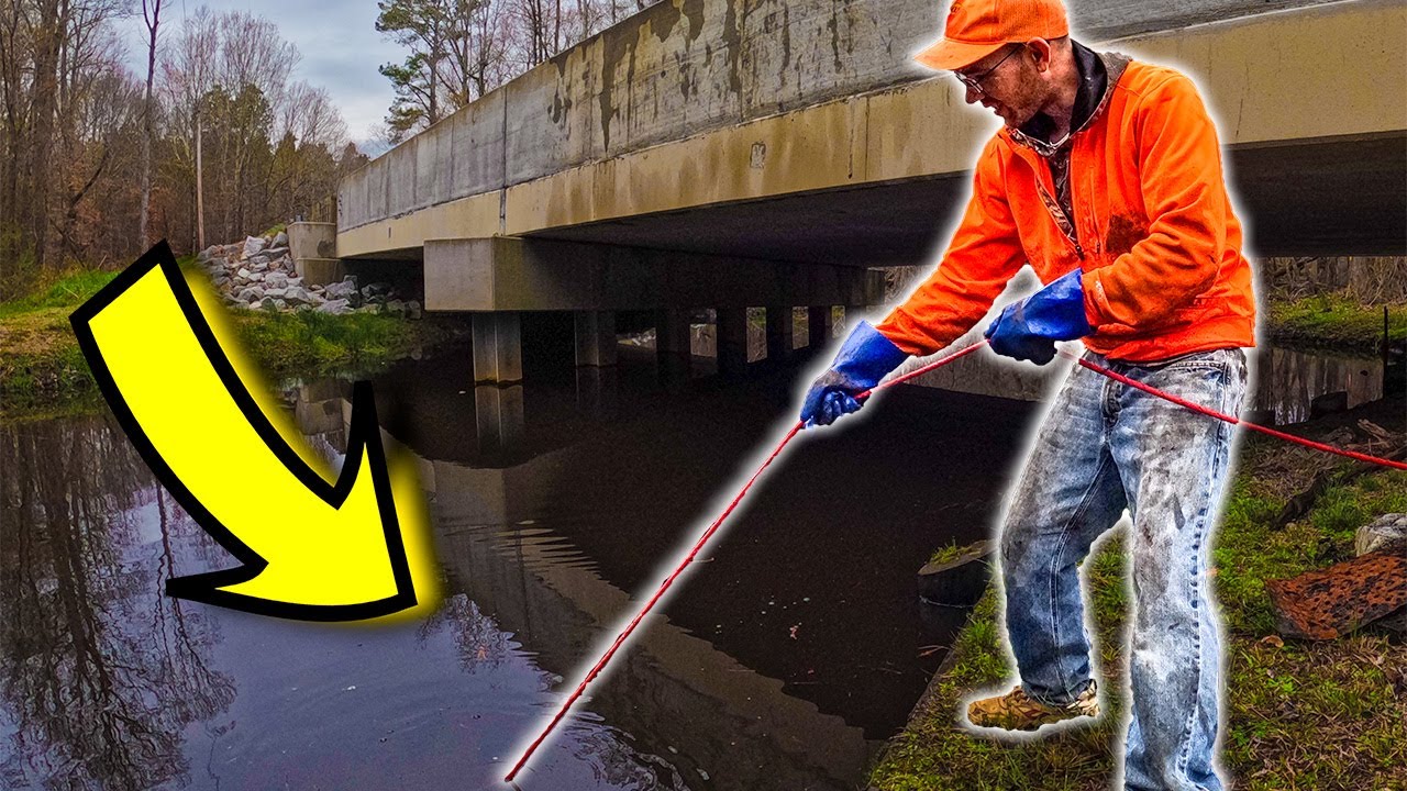 Discovering hidden treasures under an old bridge with a magnet