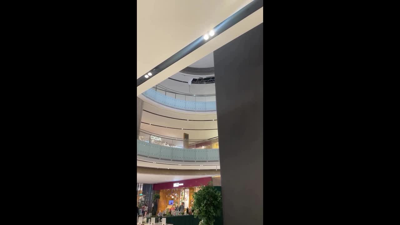 Rainwater pours from shopping mall ceiling as heavy rain hits Malaysia